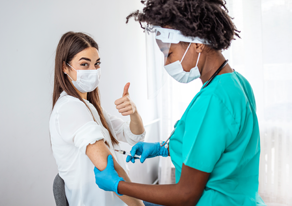 Women getting COVID-19 Vaccine